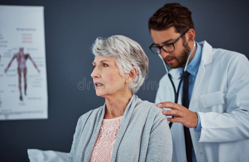 Time for Her Routine Checkup. a Doctor Examining a Senior Patient with ...