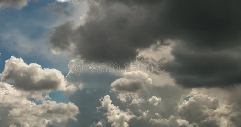 Fluffy Curly Rolling Clouds in Windy Weather. Sun Rays Throughcloud ...