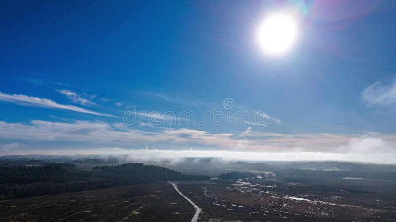 Time-lapse of Clouds Moving Above the Trees with the Bright Sun in the ...