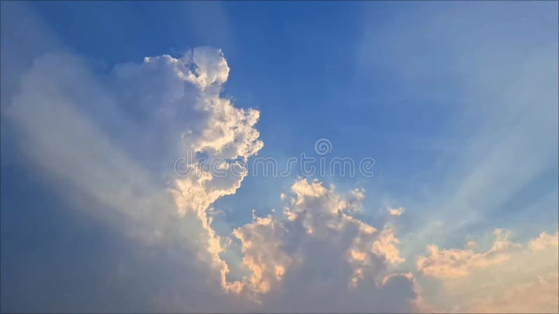 Time Lapse of Clouds Moving in Sky with Sun Rays Shining through ...