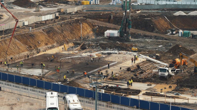 Time Lapse of Construction Site with Heavy Construction Machinery Early ...