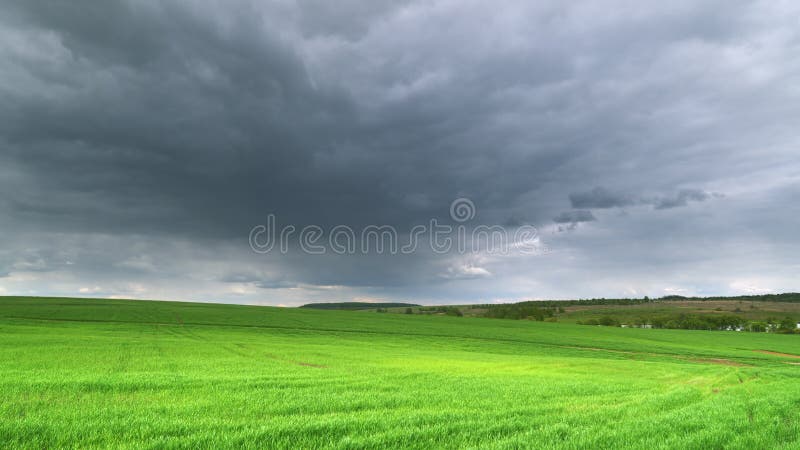 A Stunning Dramatic Cloudy Sky Over Beautiful Lush Green Fields and ...