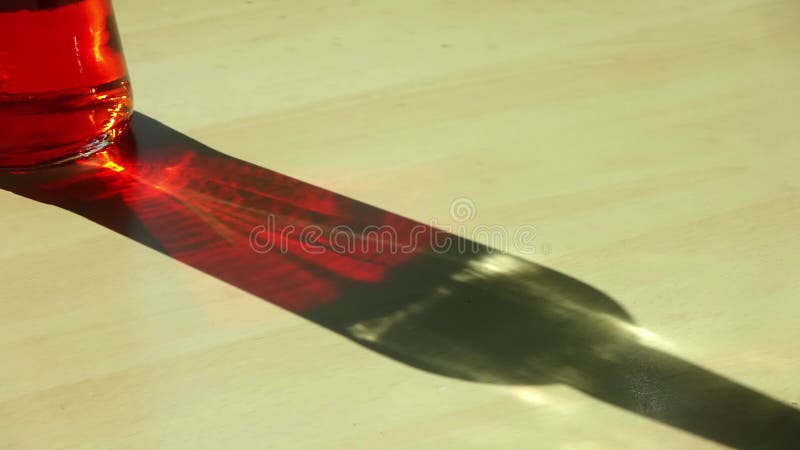 Time Lapse of a Drinking Glass with Moving Shadow and Caustic Light ...