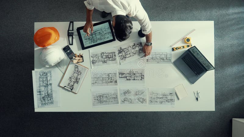 Time Lapse of Engineer Looking at Tablet while Looking at Laptop ...