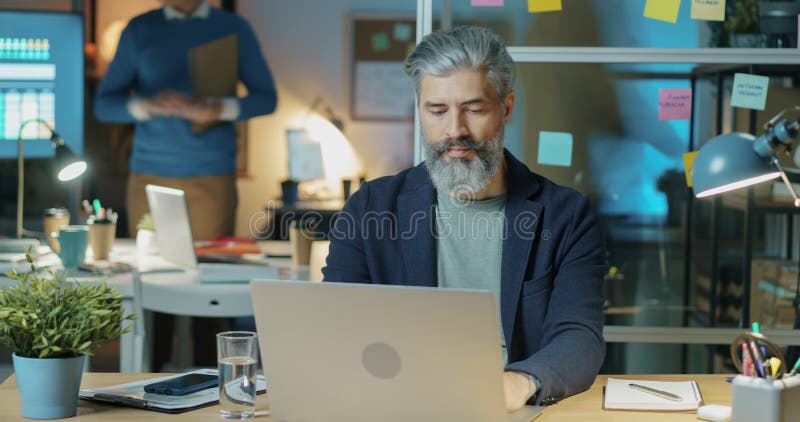 Time Lapse of Entrepreneur Working with Laptop Computer Typing while ...