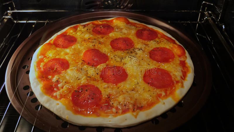 Time Lapse of Pepperoni Pizza Cooking in an Oven. Stock Footage - Video ...