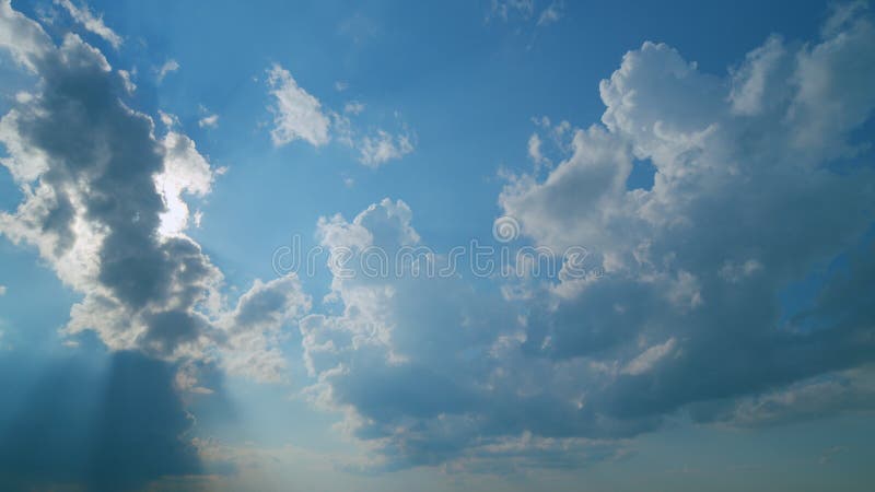 Rays of Sun through Clouds. Blue Sky with Cloudscape Backlit Bright Sunlight through Summer ...