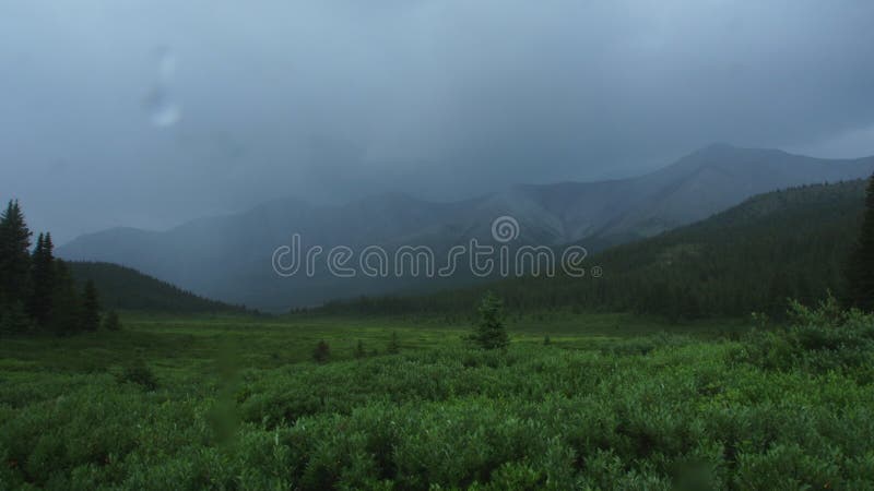Time Lapse of Rolling Clouds and Rain in the Wilderness Stock Footage ...