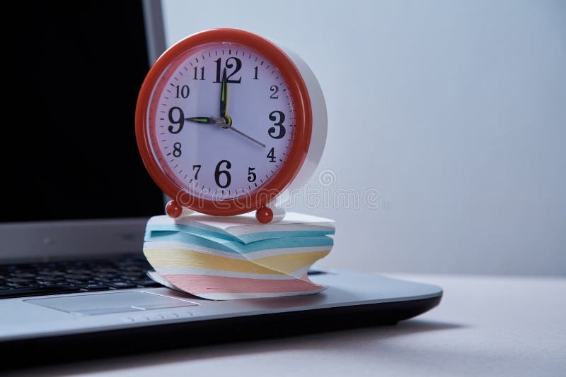 Time Management Deadline and Schedule Concept: Alarm Clock and Laptop ...