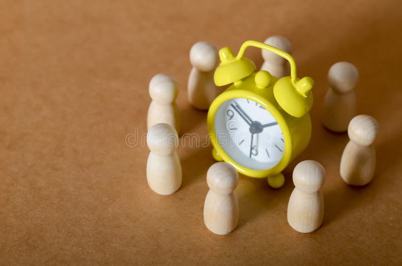 Time Management and Teamwork Concept with Wooden Figures and Alarm ...