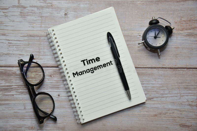 TIME MANAGEMENT Text on Notebook with Pen, Spectacles and Analog Alarm ...