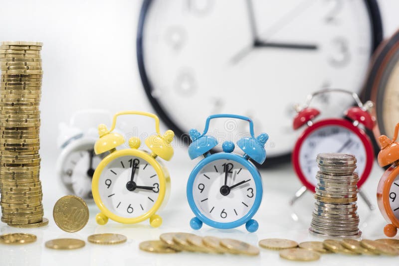 TIME is MONEY Concept: Alarm Clock and with Coins Stock Photo - Image ...