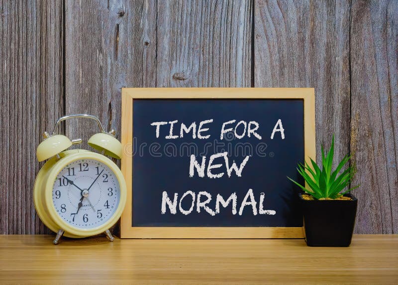 TIME for a NEW NORMAL Text on Wooden Table with Analog Clock Stock ...