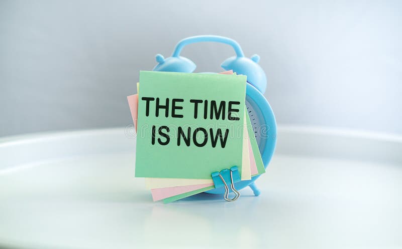The Time is Now Text on Alarm Clock Concept on Notebook. Stock Photo ...