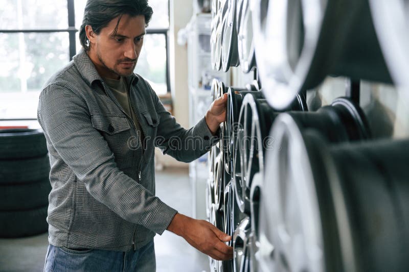 Time for Replacement. Man is in the Tire Fitting Car Service Stock ...