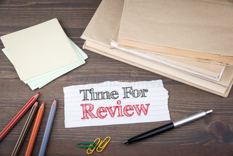 Time for Review. Paper Sheet from the Booklet on the Wooden Table Stock ...