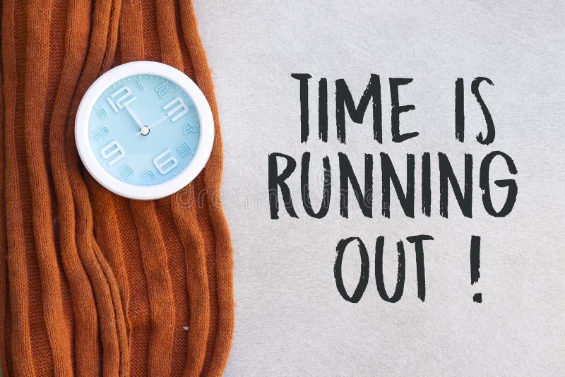 Time is Running Out Concept with Alarm Above Orange Scarf . Stock Photo ...