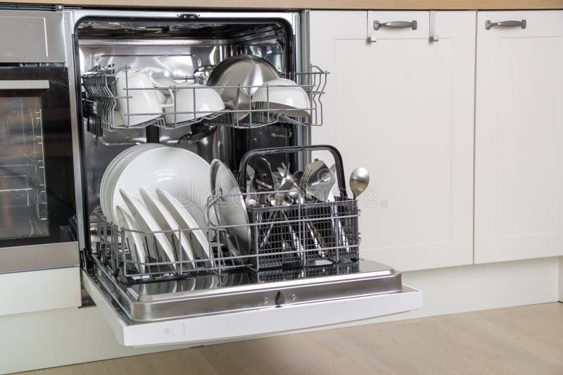 Time-saving Technology. Open Built-in Dishwasher. Kitchen with ...