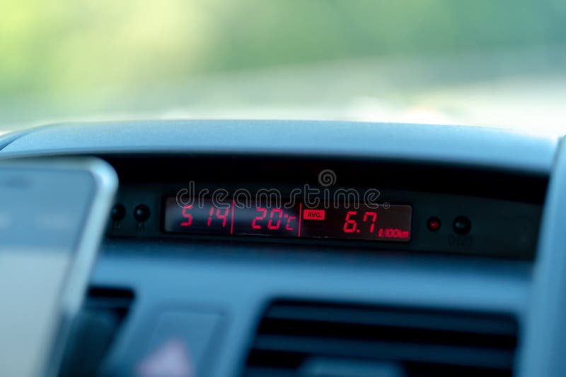Time and Temperature and Speed Written on the Dashboard of a Car Stock ...