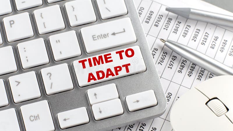 TIME TO ADAPT Text on Keyboard Wirh Chart and Pencil Stock Photo ...