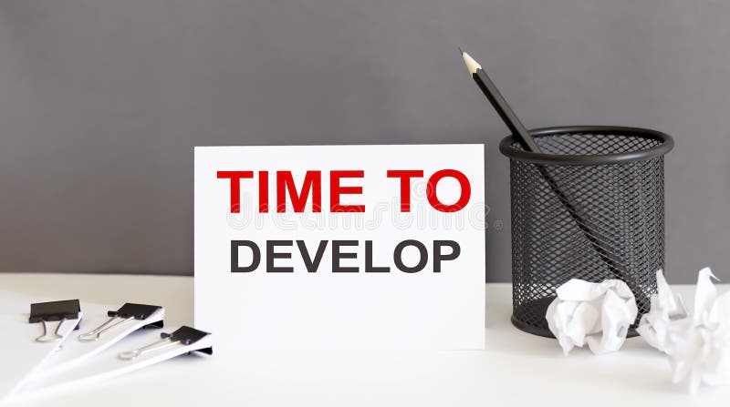 TIME TO DEVELOP Text and Office Supplies, Business Concept Stock Photo ...