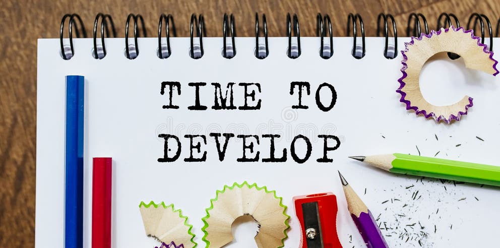 TIME TO DEVELOP Text Written on a Paper with Pencils in Office Stock ...
