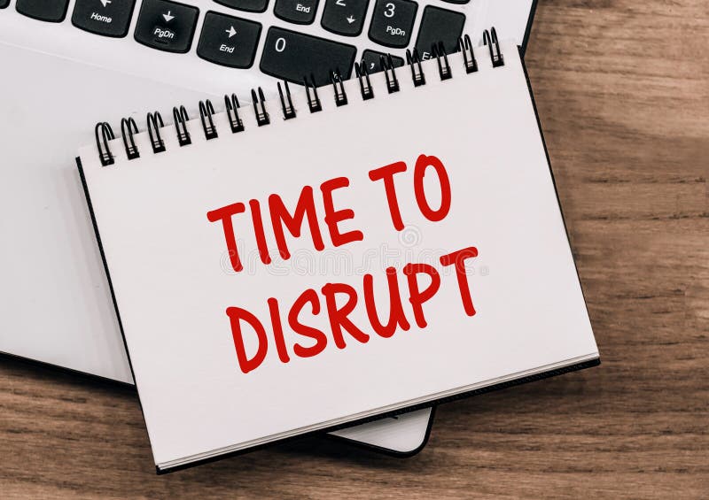Time To Disrupt Written on a Notepad Next To a Laptop on a Wooden Desk ...