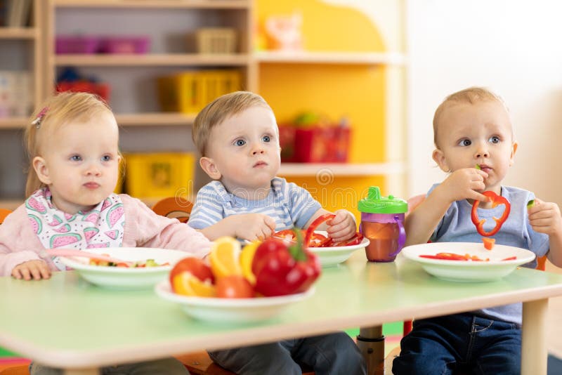Time To Eat in Kindergarten Stock Photo - Image of group, indoor: 135670792