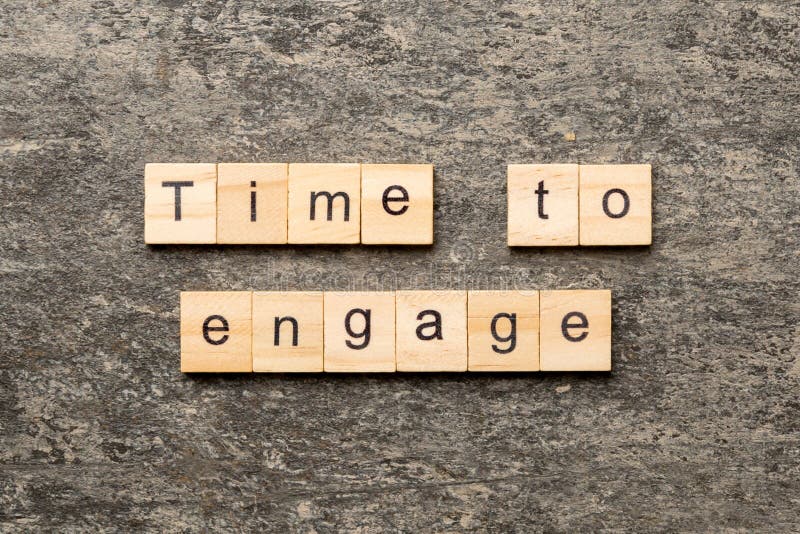 Time To Engage Word Written on Wood Block. Time To Engage Text on Table ...