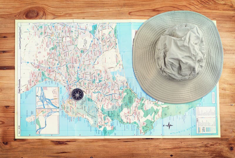 Time To Explore. a Compass and a Hat Lying on a Map on a Table. Stock ...