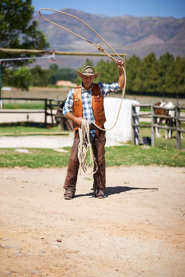 Time To Lasso an Outlaw. a Man with a Lasso on the Farm. Stock Image ...