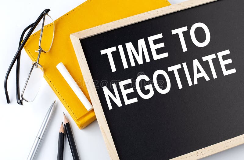 TIME TO NEGOTIATE Text on the Blackboard with Notepad , Pen, Pencil ...