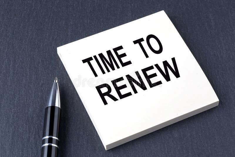 TIME TO RENEW Text on the Sticker with Pen on Black Background Stock ...