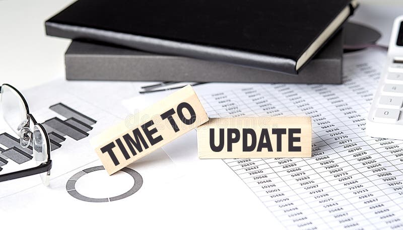 TIME TO UPDATE - Text on a Wooden Block with Chart and Notebook Stock ...