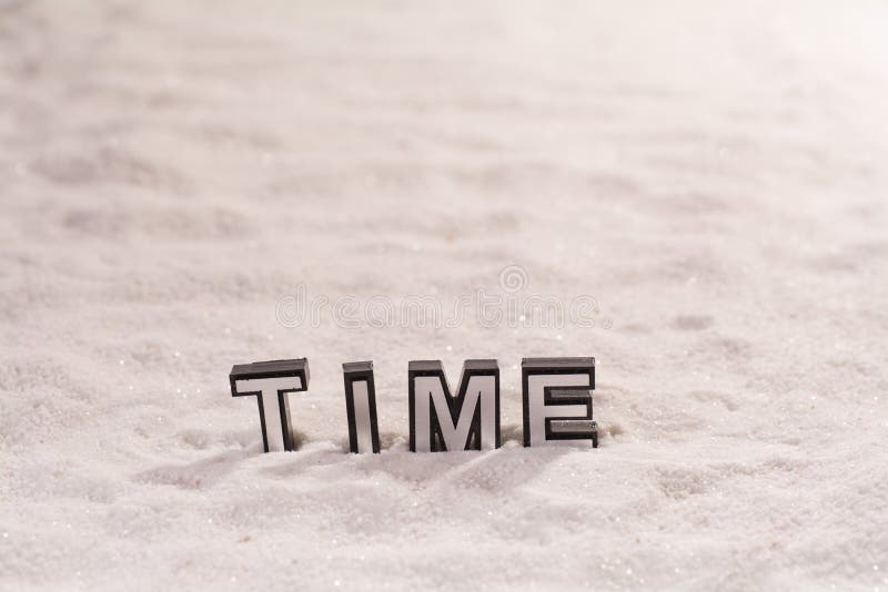 Time word on white sand stock photo. Image of metal - 119344854
