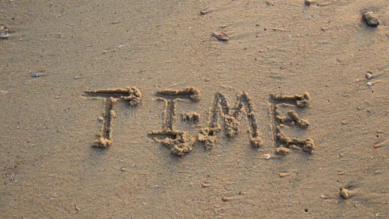 Time Written in the Sand at the Beach Waves in the Background Stock ...