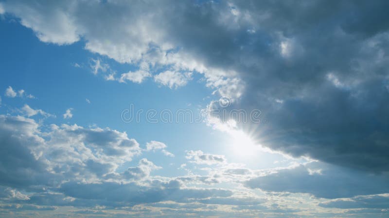 Bright Rays of the Sun Shining through Clouds. Bright Sun on Blue ...