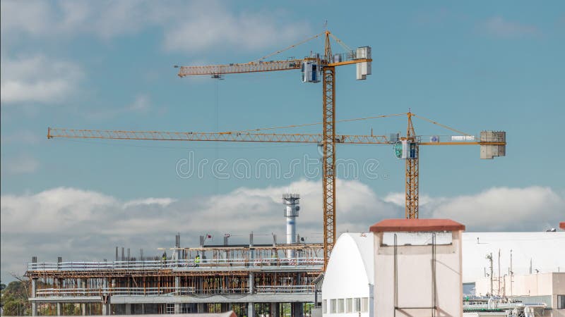 Timelapse of Construction Site with Cranes Working on a Building ...