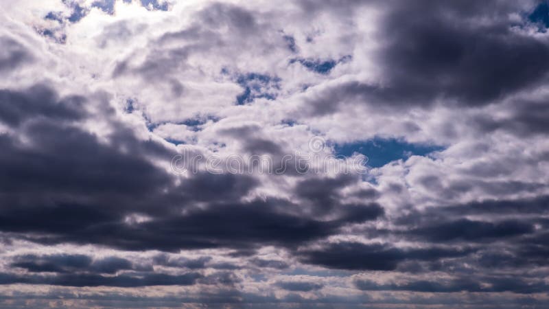 Timelapse of Cumulus Storm Clouds Moving in the Sky with Sun Over the ...