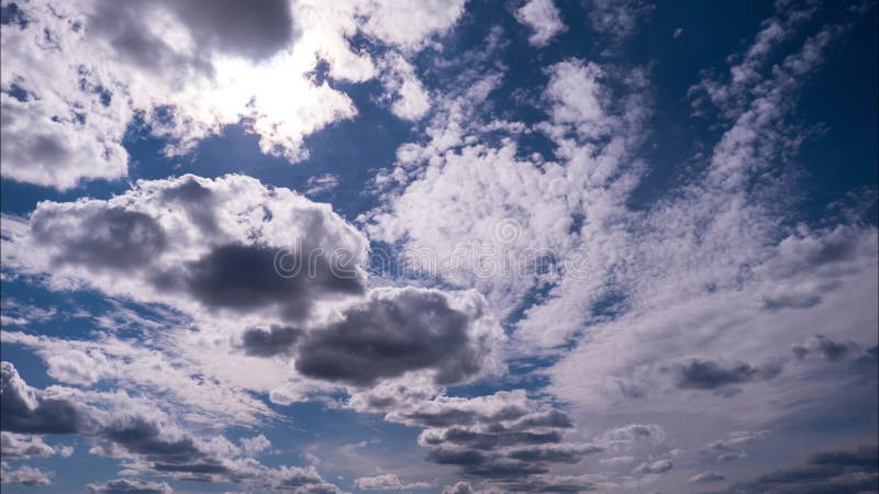 Timelapse of Fluffy Clouds Moving Under the Sun in the Blue Sky Stock ...