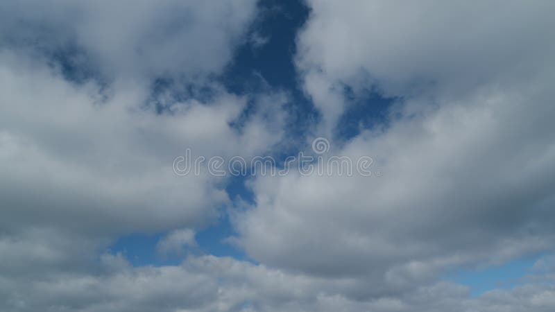 Fluffy Curly Rolling Clouds in Windy Weather. Sun Rays Throughcloud on ...