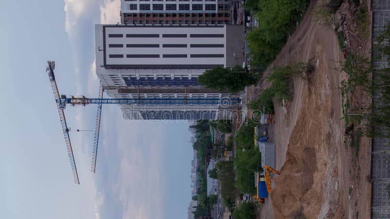 Static Construction Crane Near Apartment Building with Fast Moving ...