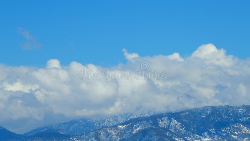 High Mountains. Mountain Range Peak Covered in Snow Blue Sky with ...