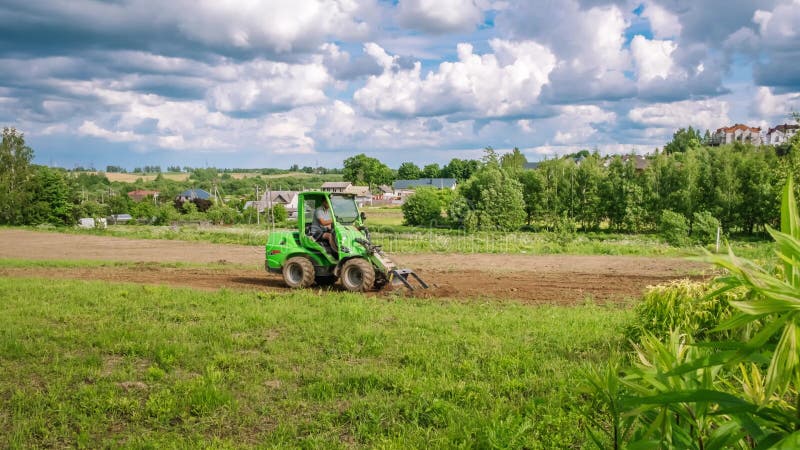 Timelapse. Mini Skid Steer Loader Clear the Construction Site Stock ...