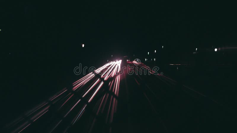 Timelapse Shot of a Road through a Chain Link Fence during Night Stock ...