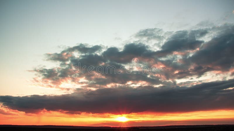 Timelapse Sunset on an Agricultural Field. Clouds Move from the Sun ...