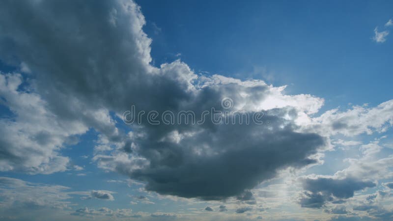 Fluffy Curly Rolling Clouds in Windy Weather. Sun Rays Throughcloud ...