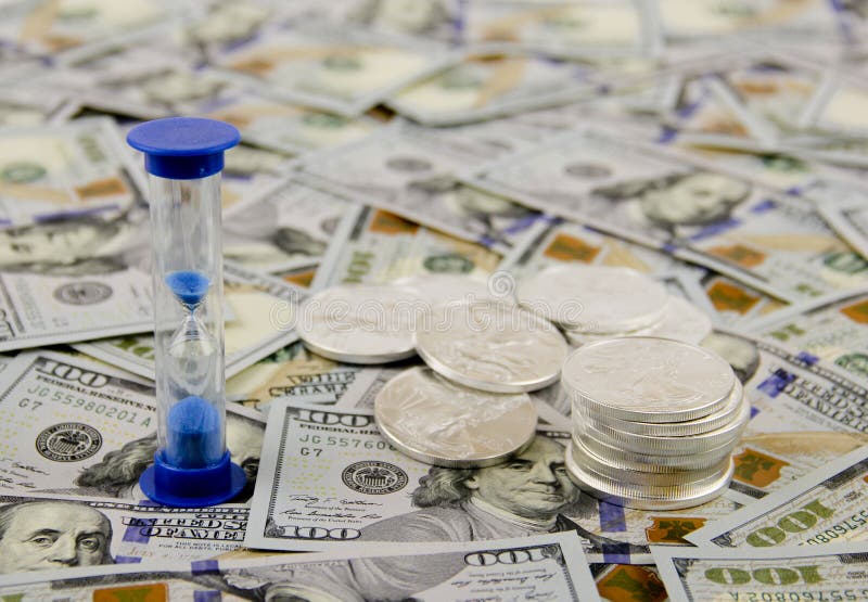 Timer on a layer of money stock image. Image of investments - 136435939