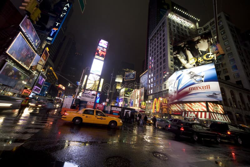 Times Square 3 editorial photo. Image of rain, tourists - 4707971