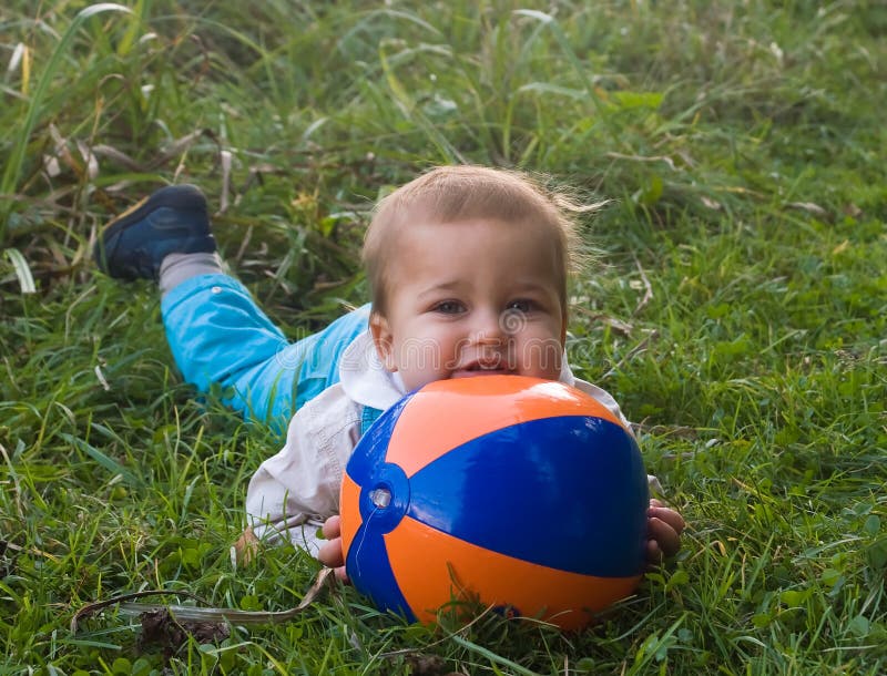 Timid child with ball stock image. Image of summer, small - 3863823